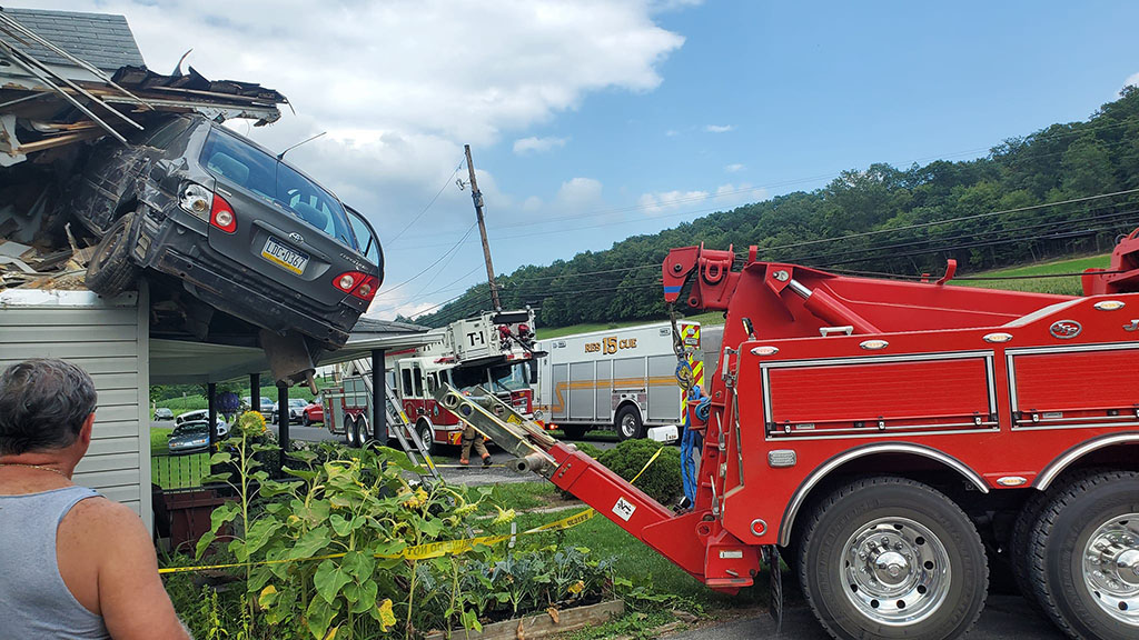 Driver Goes Full-Send with Toyota Corolla Crashing into Top of House ...